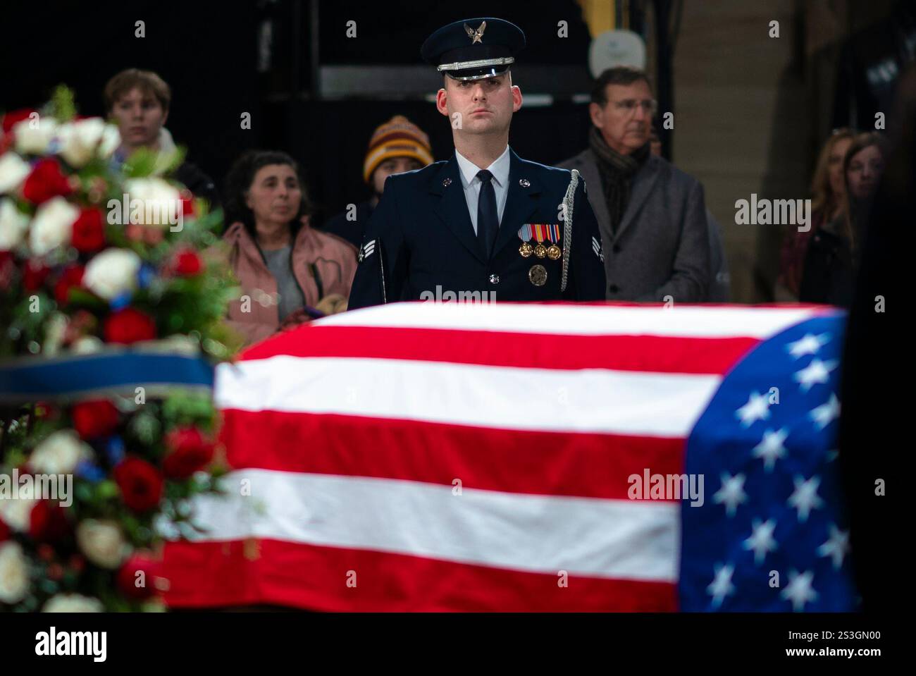 A soldier stands at attention at Former President Jimmy Carter's casket ...