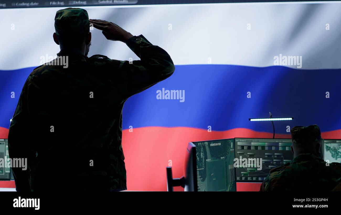 Russian army soldier presenting the official salute in operations room ...