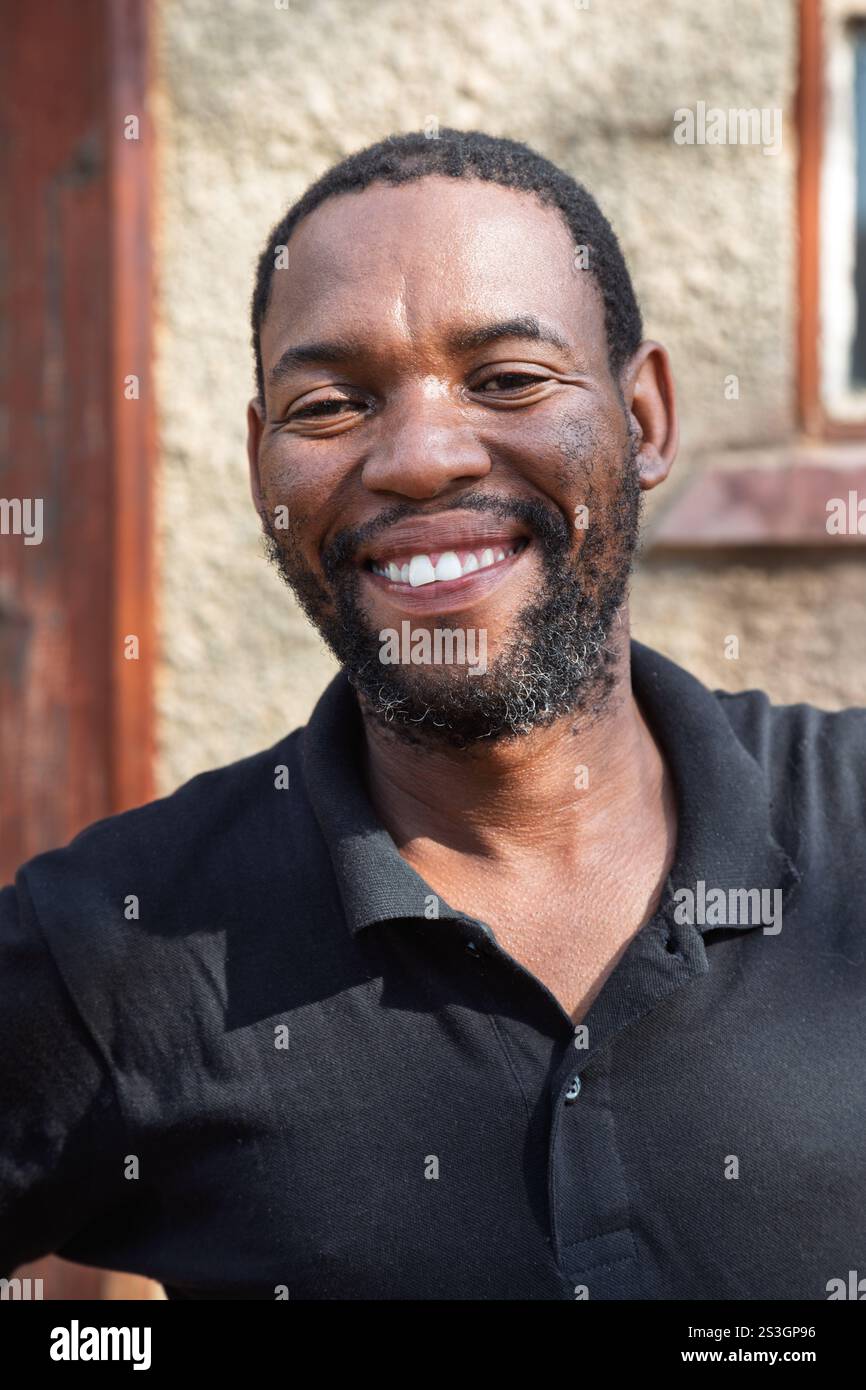african village, portrait single smiling african man with a beard, in ...