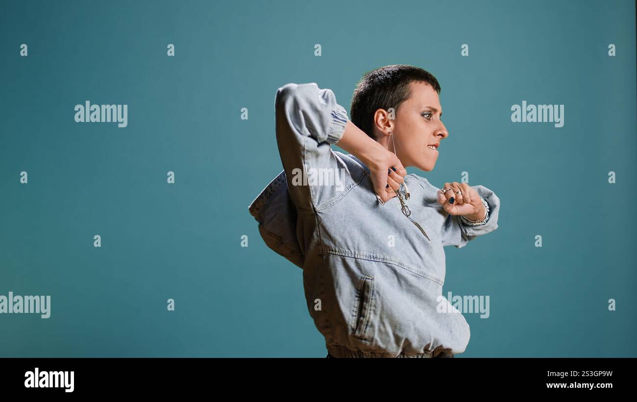 Groovy bold funky woman dancing and fooling around in the studio ...