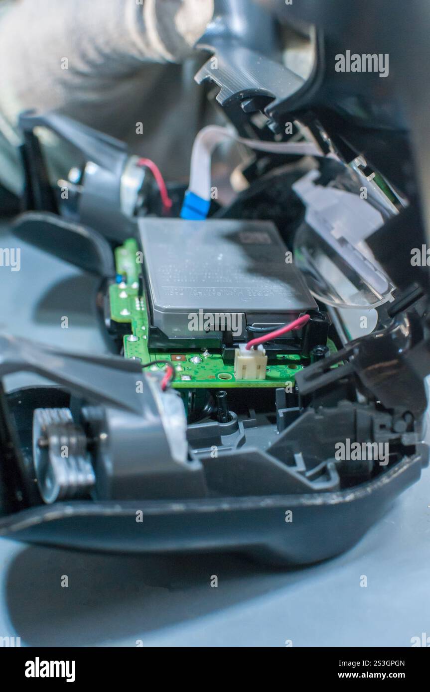 A video game controller lies open on a desk to be checked Stock Photo ...