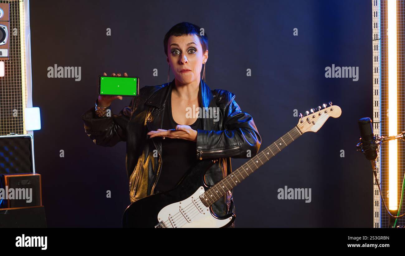 Cool rebellious rock star does a live performance pointing to copy ...