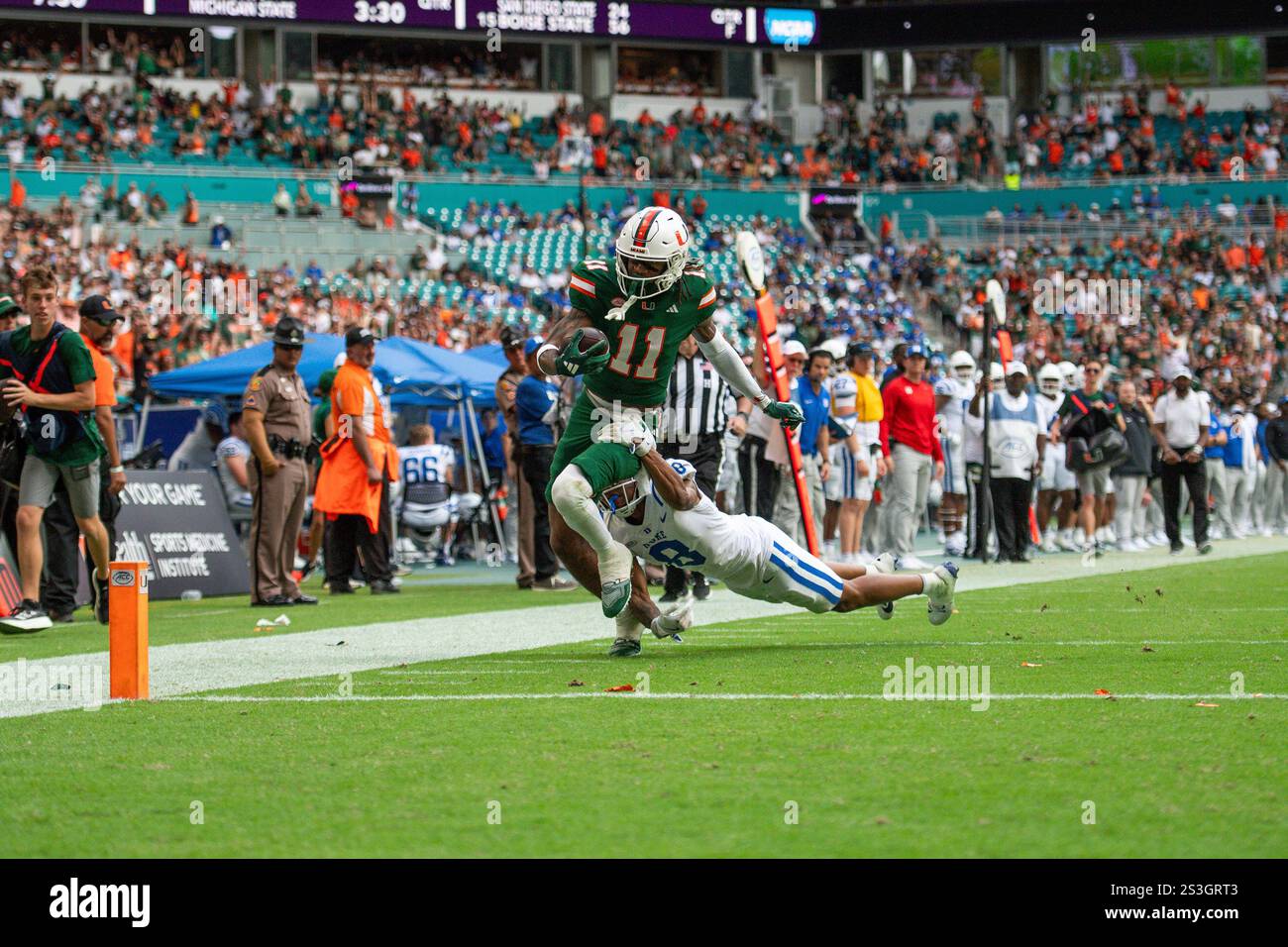 Miami wide receiver Sam Brown Jr. (11) runs the ball during an NCAA ...