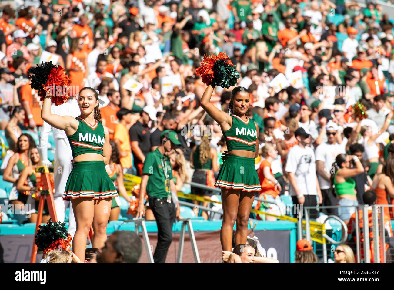University of Miami cheerleaders stunt during an NCAA football game ...