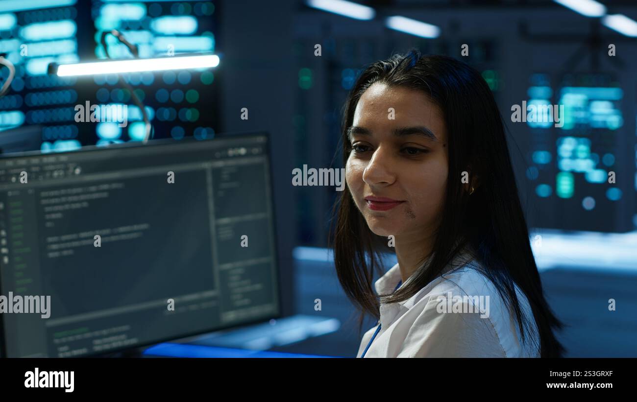 Portrait Of Cheerful Engineer In Data Center Installing Software On Computer Troubleshooting