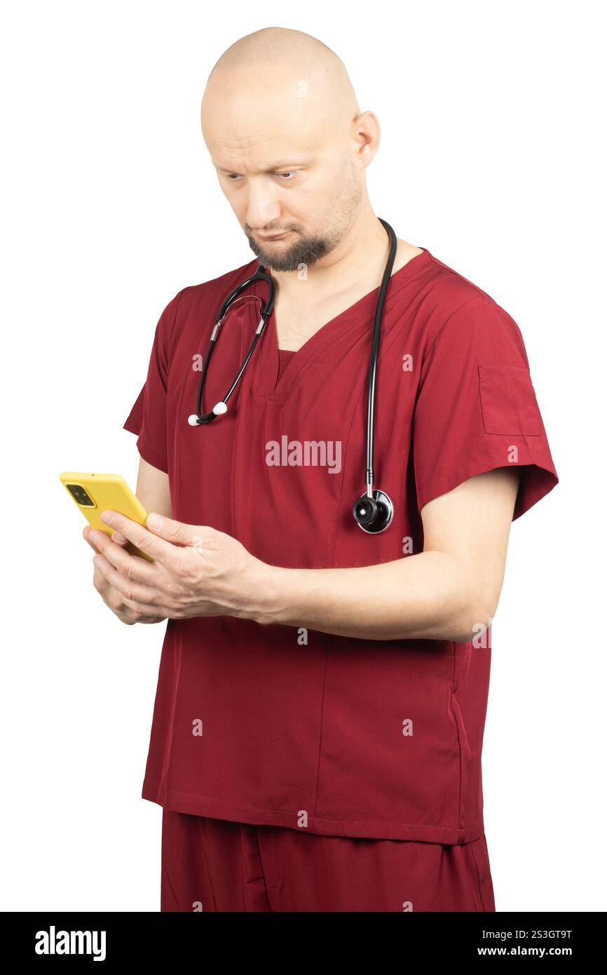 A bald male doctor with a beard is wearing red scrubs and has a ...