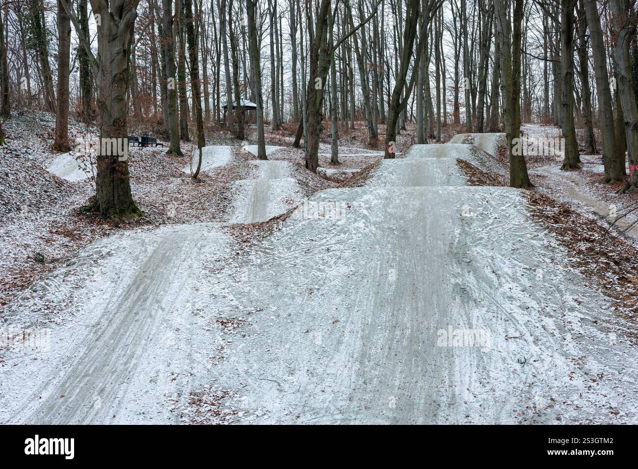 Bike paths and stunt ramps in the city's winter park Stock Photo - Alamy