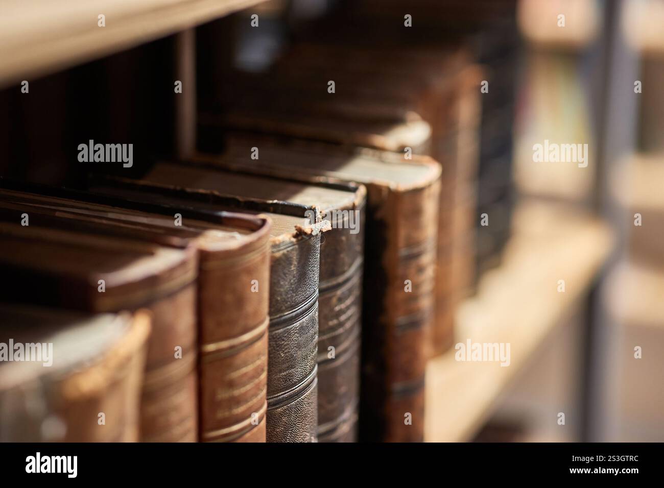 Old books in a library Stock Photo - Alamy