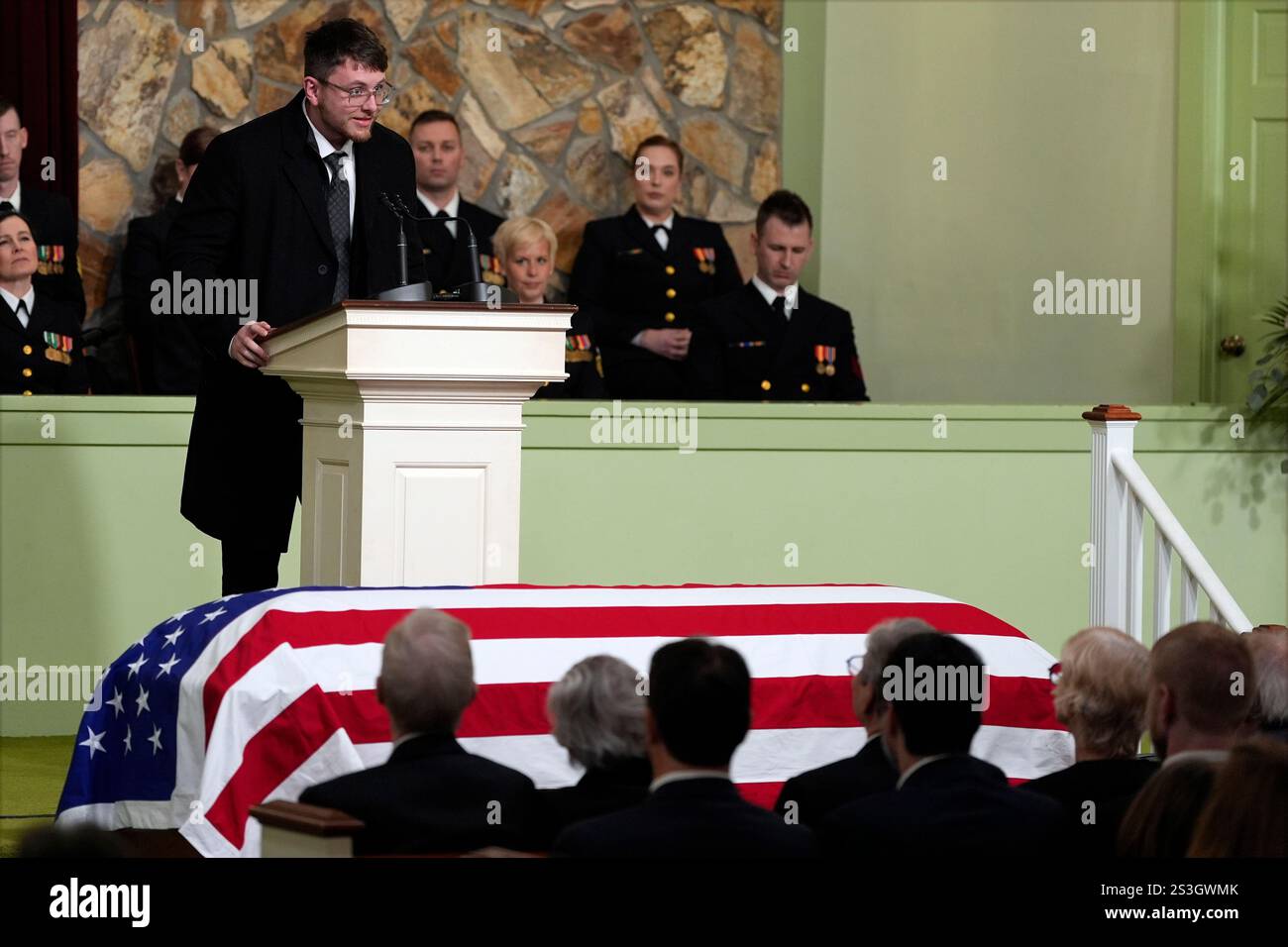 Hugo Wentzel reads scripture during the funeral service for former ...