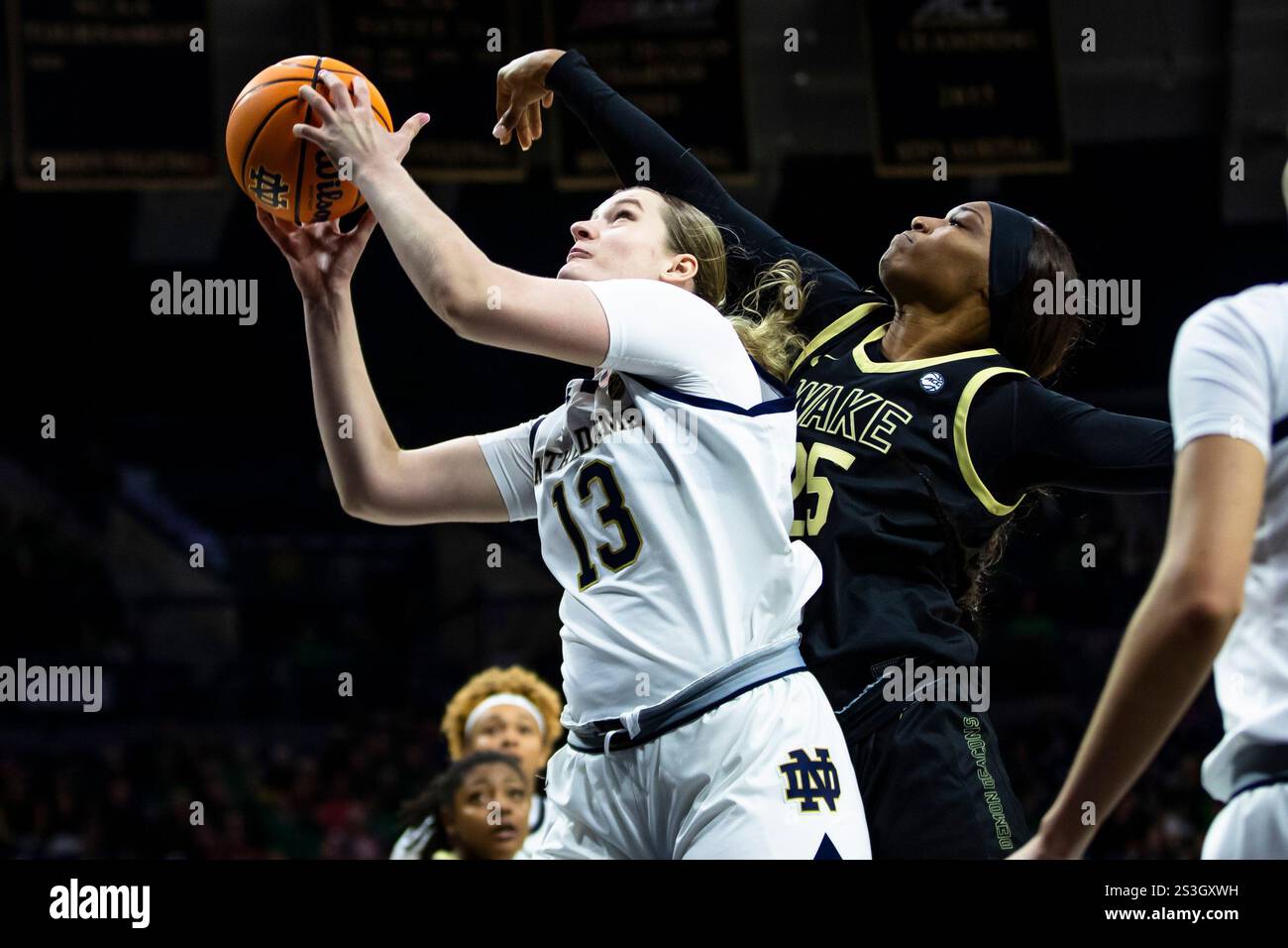 Notre Dame forward Kate Koval (13) drives as Wake Forest forward ...