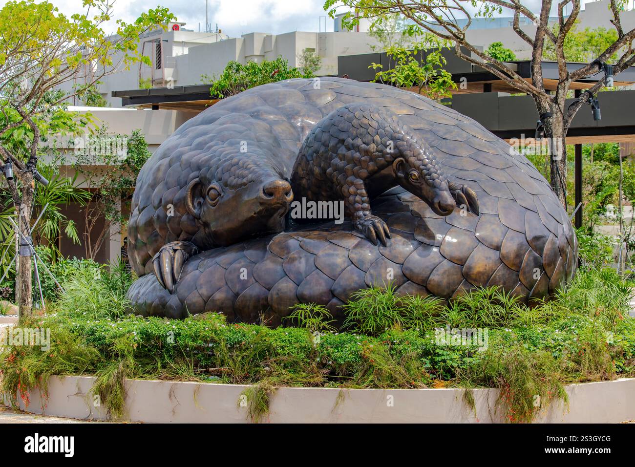 The sculpture of a mother and baby Malayan pangolin in front of the ...
