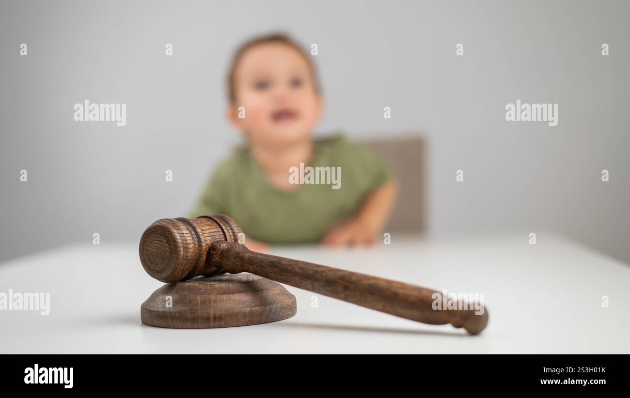 Little boy behind judge's gavel Stock Photo - Alamy