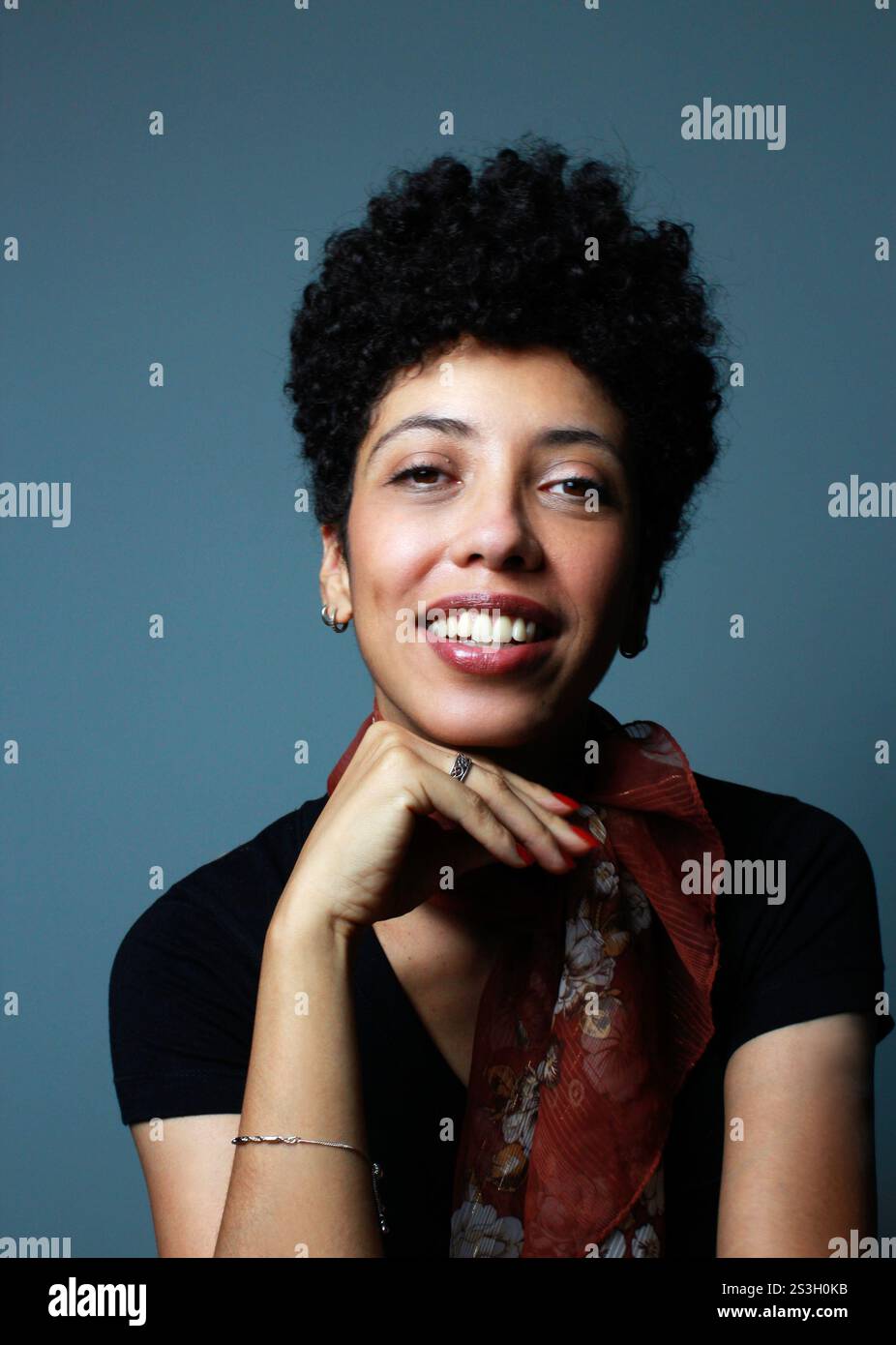 Vertical portrait of charming afro american woman smiling and looking ...