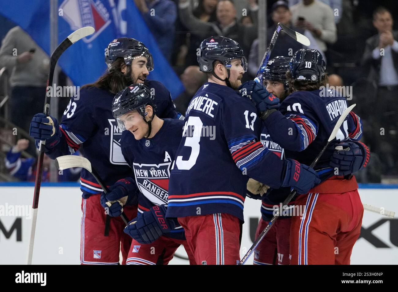 New York Rangers' Adam Fox, second from left, celebrates with teammates ...