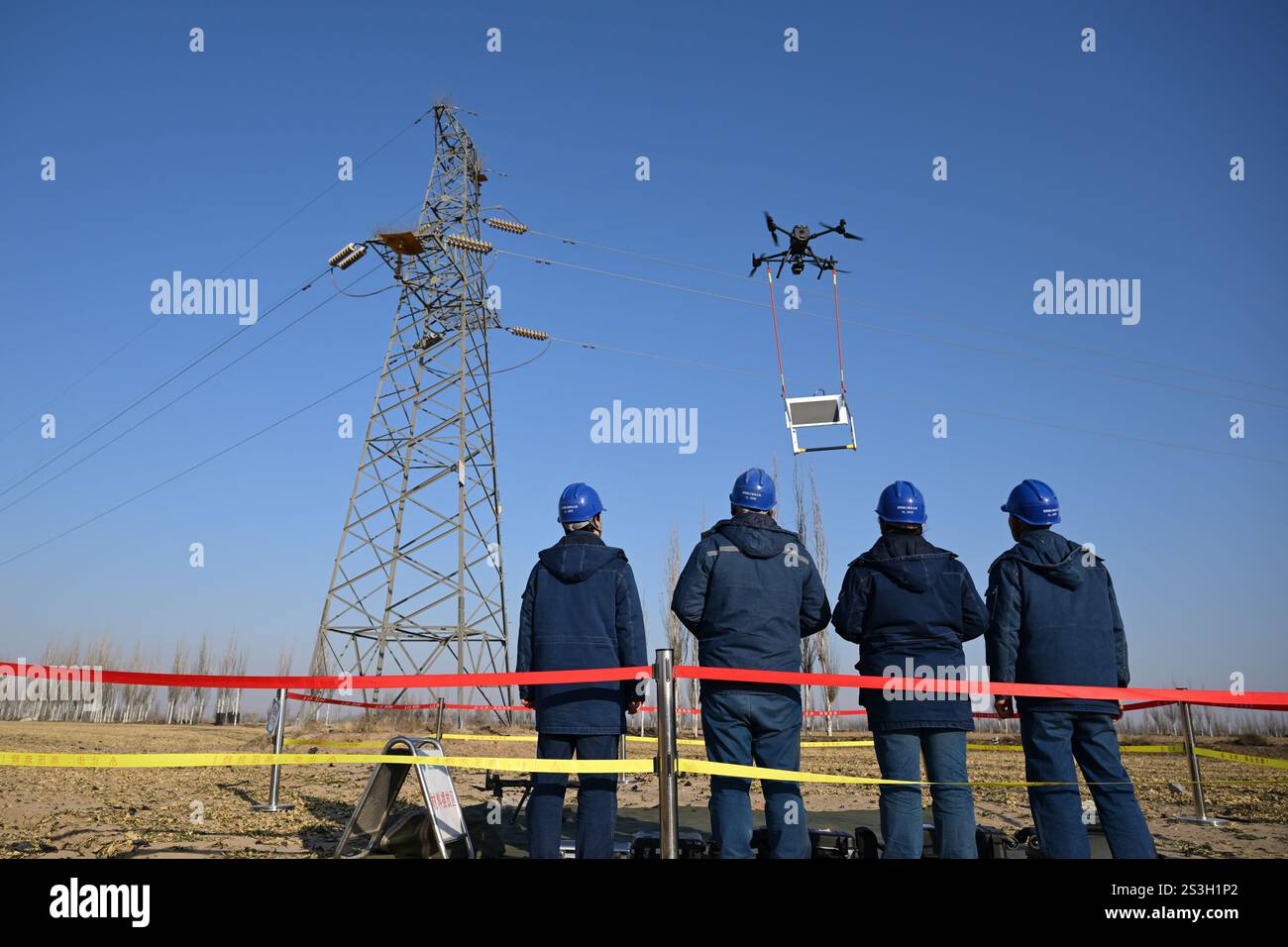 YINCHUAN, CHINA - JANUARY 9, 2025 - State Grid workers at the 110 kV ...