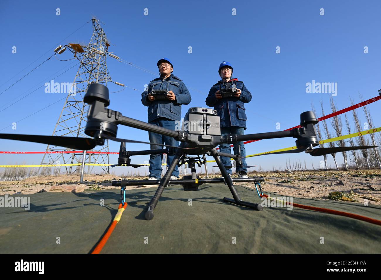 YINCHUAN, CHINA - JANUARY 9, 2025 - State Grid workers at the 110 kV ...