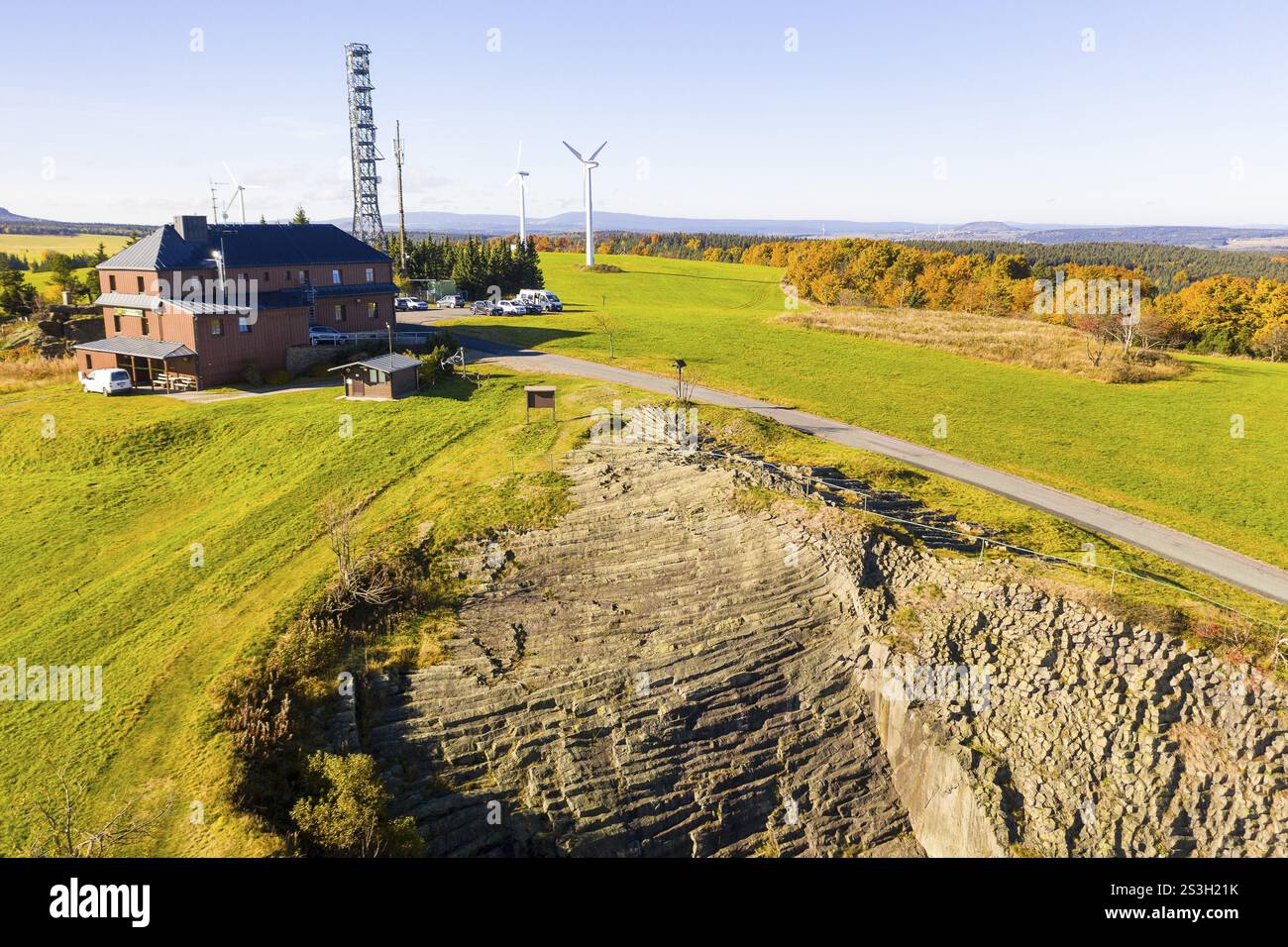Basalt outcrop from a former quarry on the Hirstsein with mining hut ...