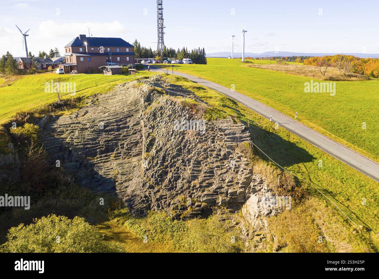 Basalt outcrop from a former quarry on the Hirstsein with mining hut ...