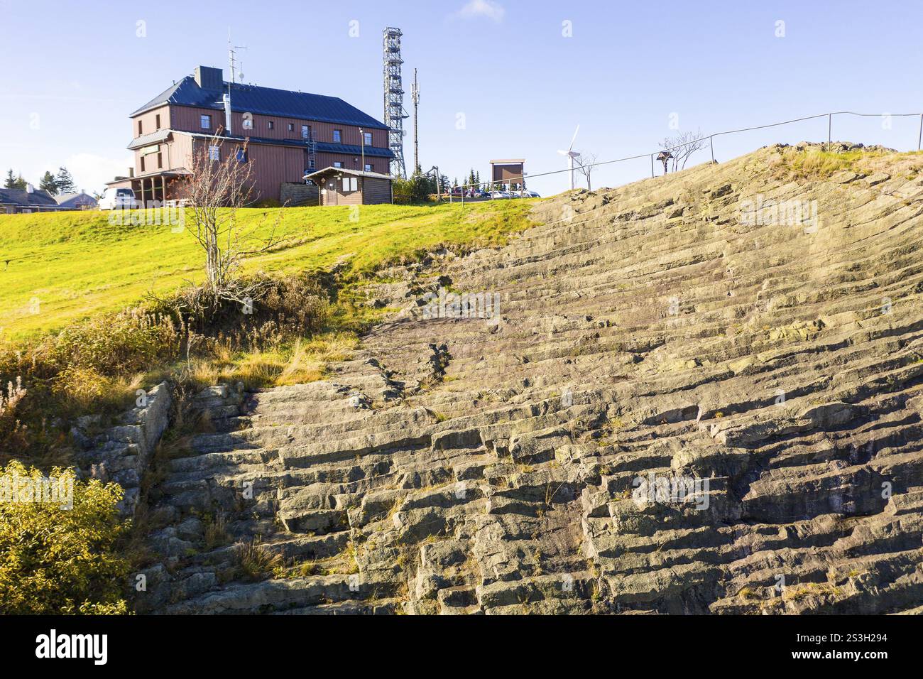 Basalt outcrop from a former quarry on the Hirstsein with mining hut ...