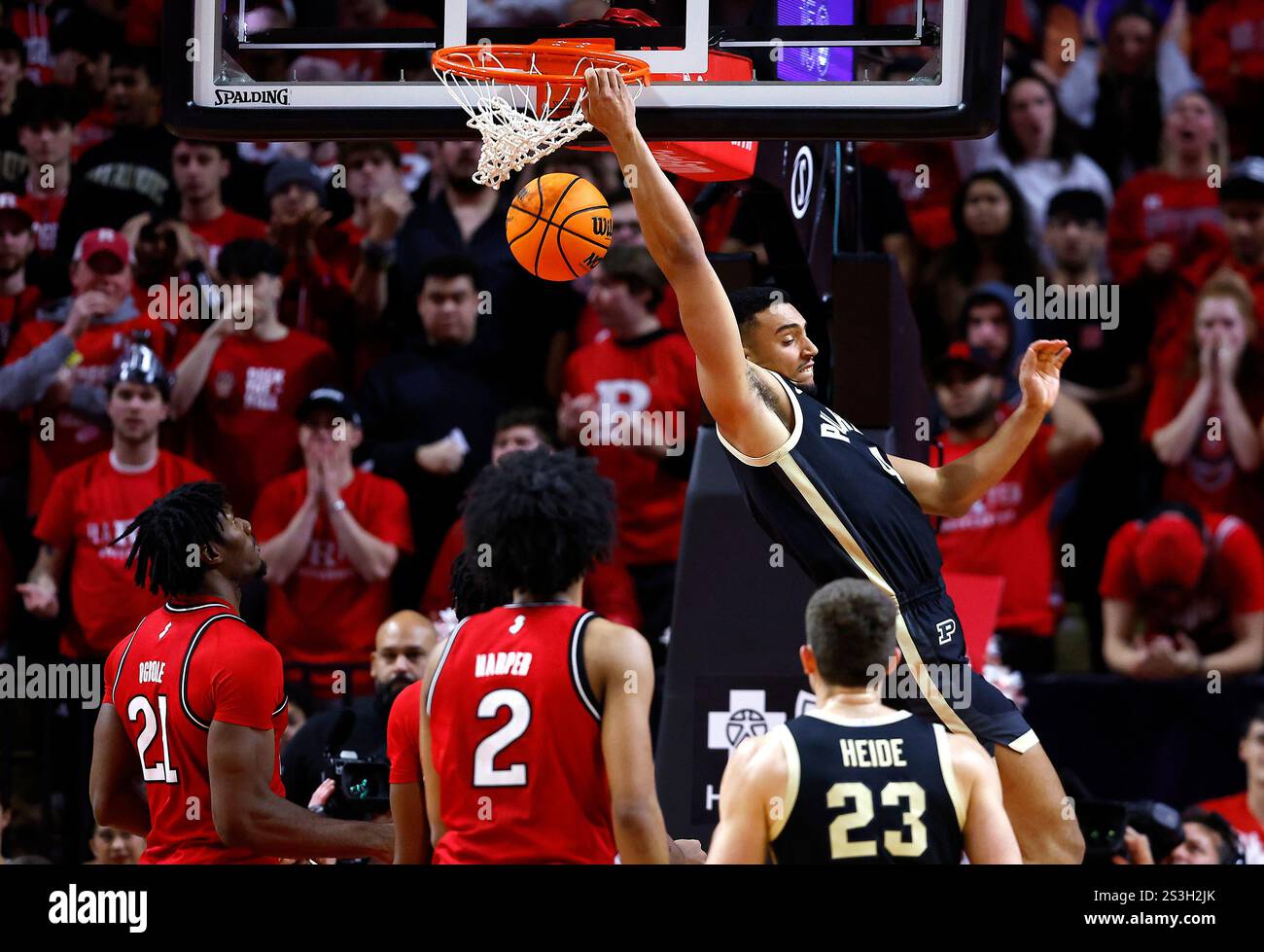 Purdue forward Trey Kaufman-Renn, top right, dunks against Rutgers ...