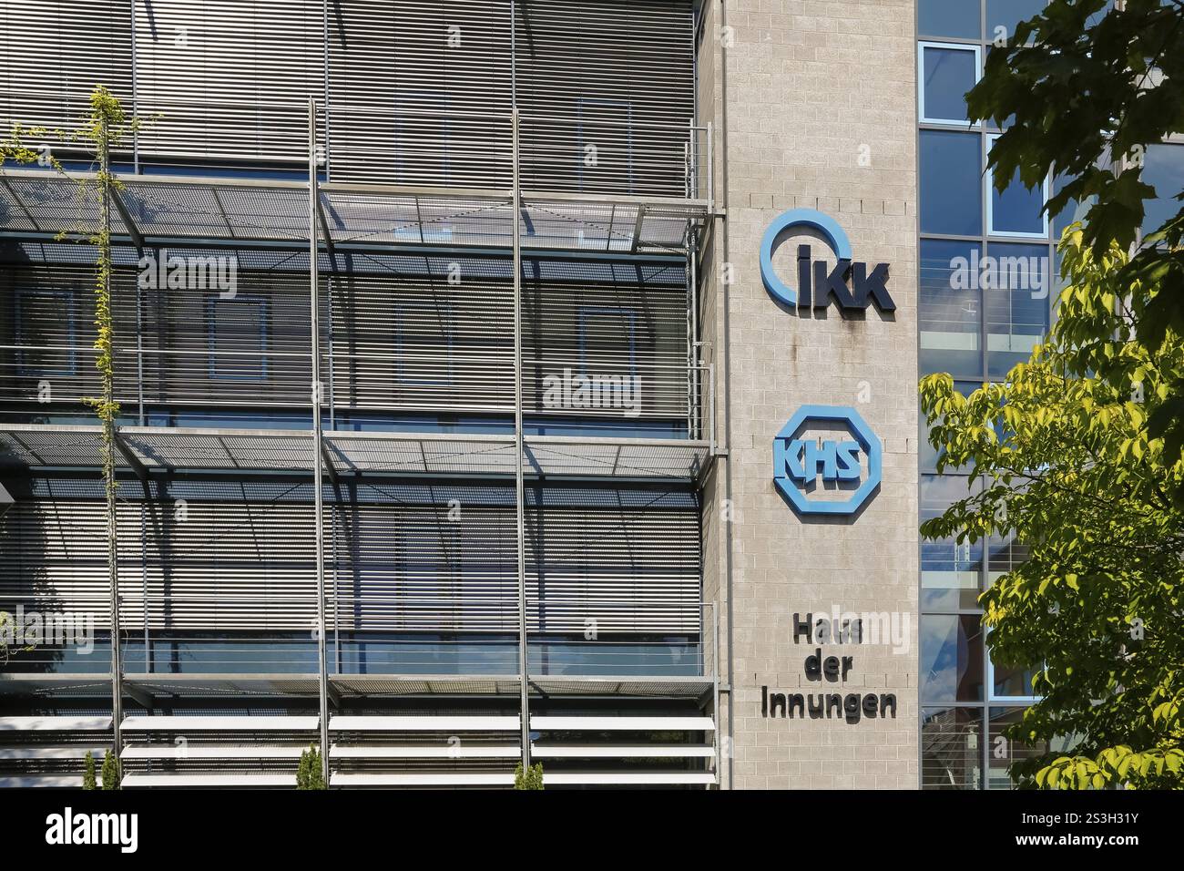 House of the guilds, facade with logos, IKK, health insurance company ...