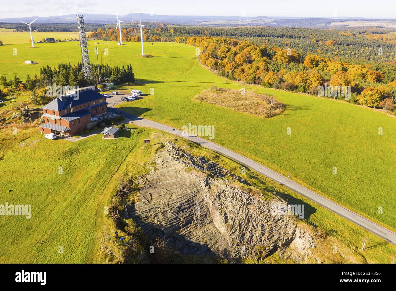 Basalt outcrop from a former quarry on the Hirstsein with mining hut ...