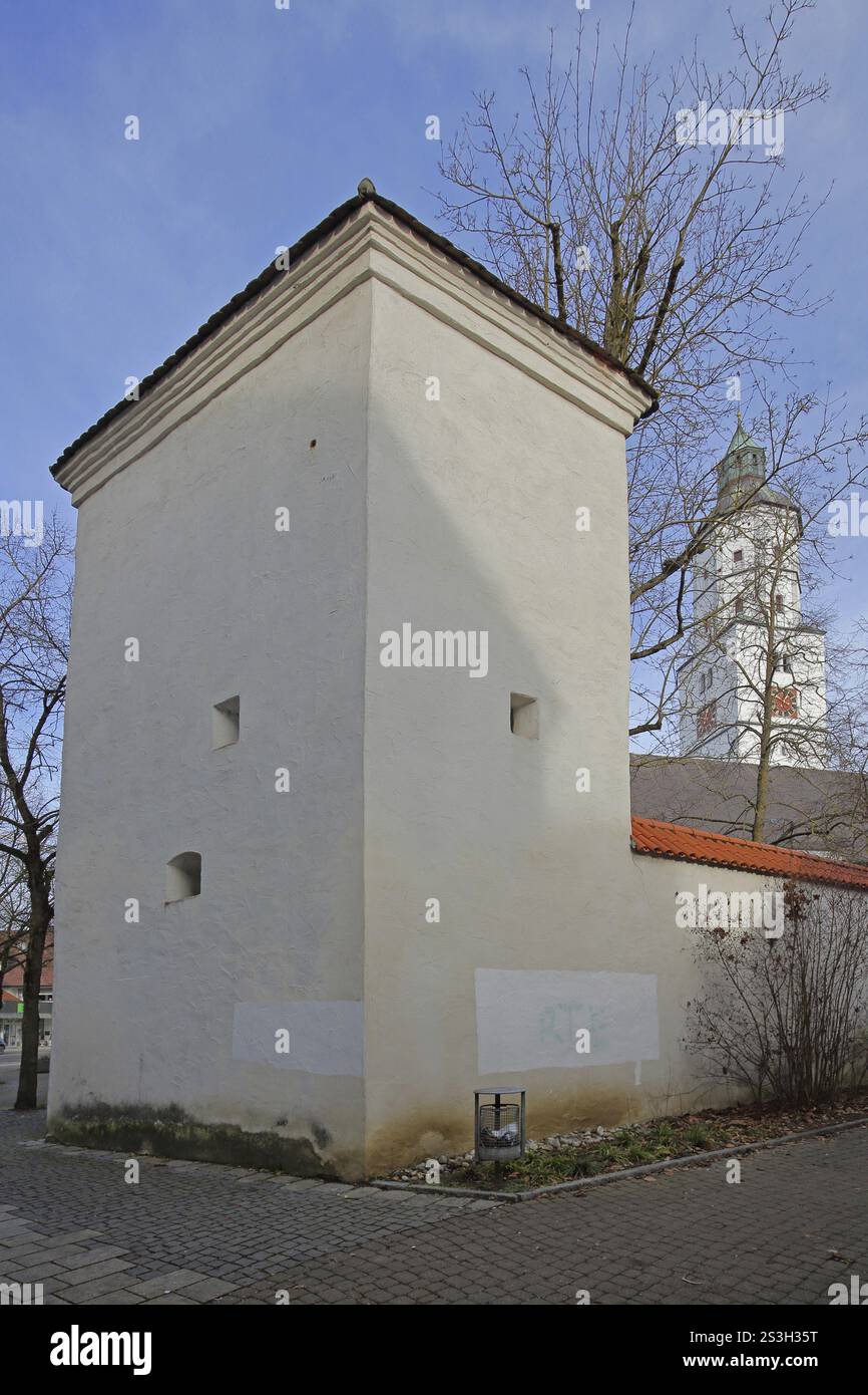 Historic prison tower with town wall and steeple of St Martin's Church ...