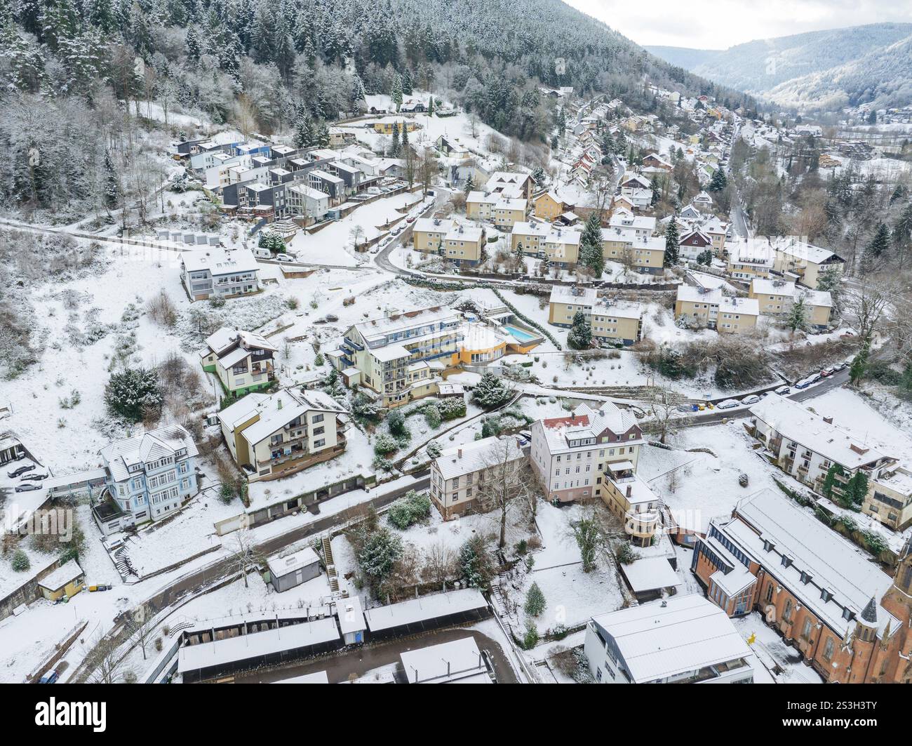 Bird's eye view of a snow-covered settlement with small houses and ...