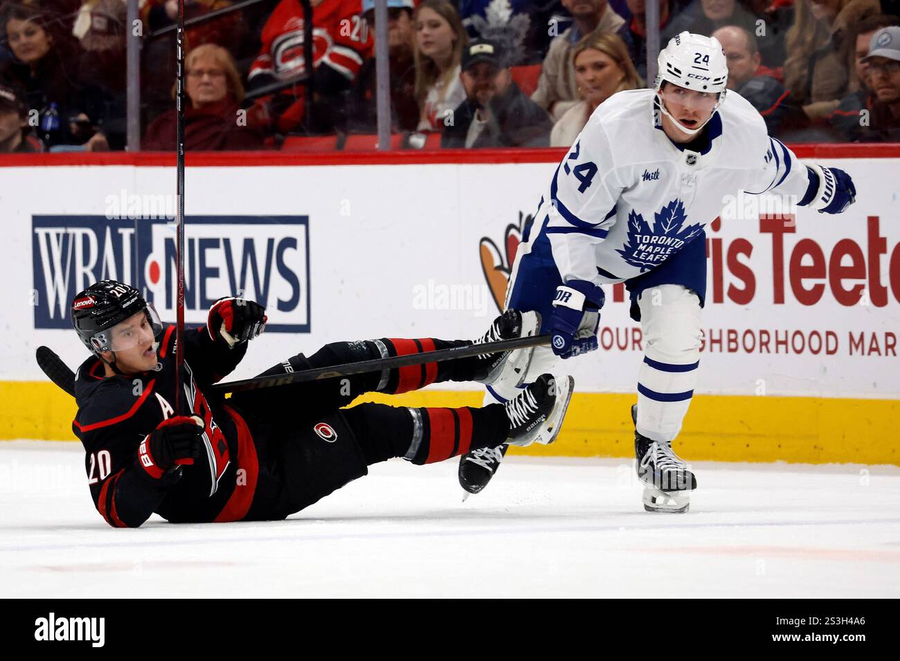 Toronto Maple Leafs' Connor Dewar (24) collides with Carolina ...