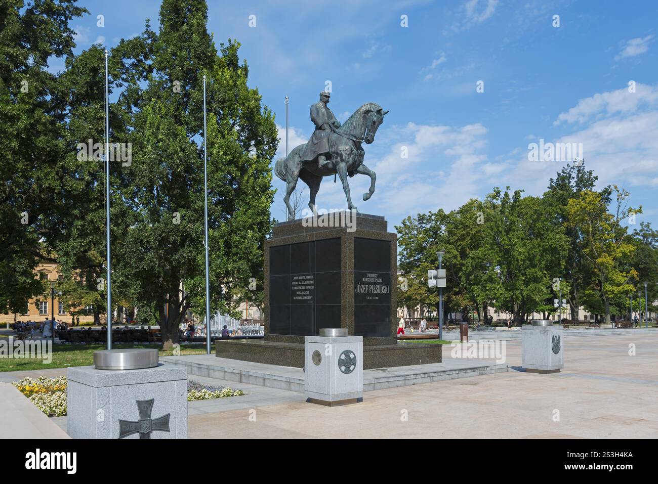 Monumental equestrian statue in a sunny park with surrounding ...