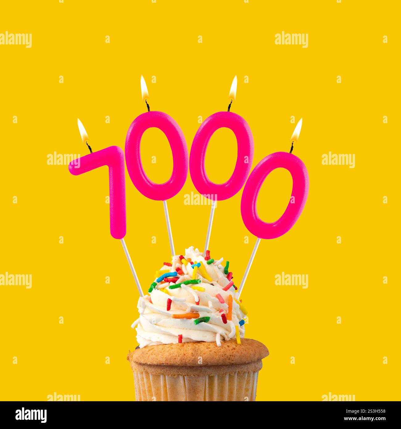 Candles forming the number 7000 - Yellow background Stock Photo - Alamy