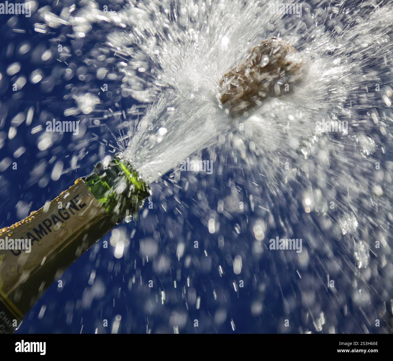 Popping cork of an opened champagne bottle Stock Photo - Alamy