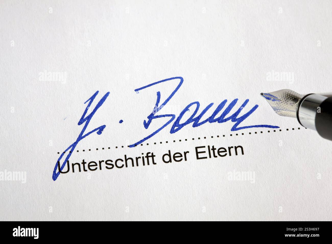 Parents' signature on a student's report card Stock Photo - Alamy