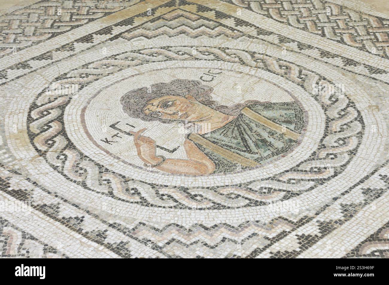 Remains of ancient mosaic floor ornament at House of Eustolios. Woman ...