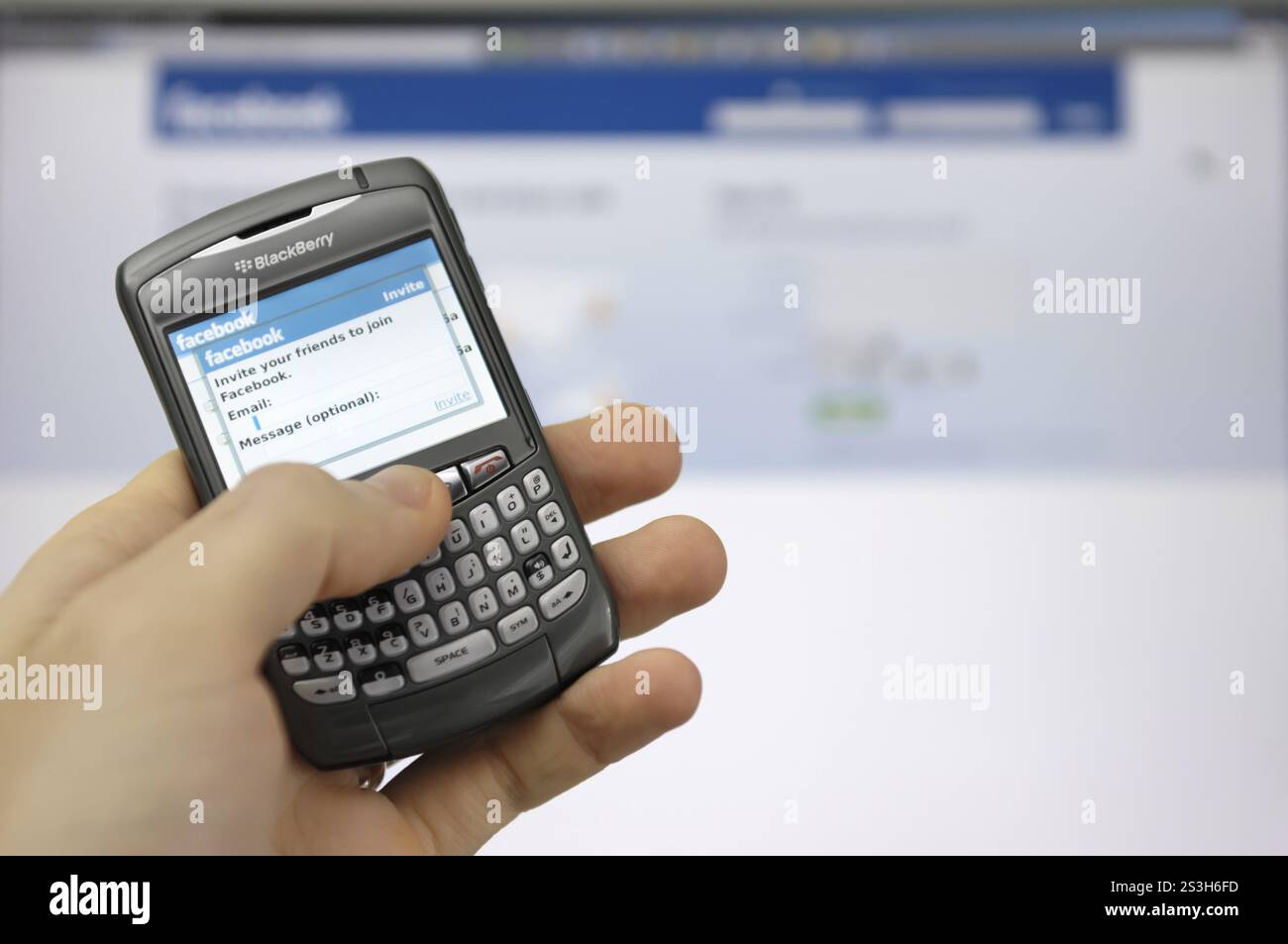 Facebook invitation screen on a display of Blackberry smartphone Stock ...