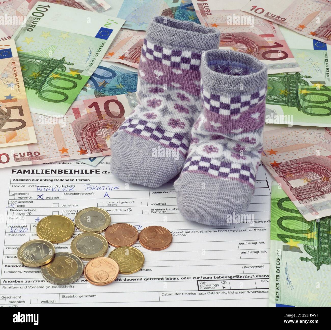 Children's socks and euro banknotes Stock Photo - Alamy