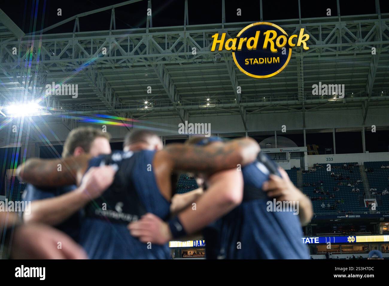 Penn State players huddle in warmups before the 2025 Capital One Orange ...