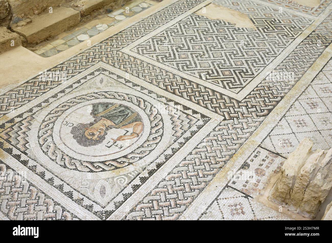 Remains of ancient mosaic floor ornament at House of Eustolios. Woman ...