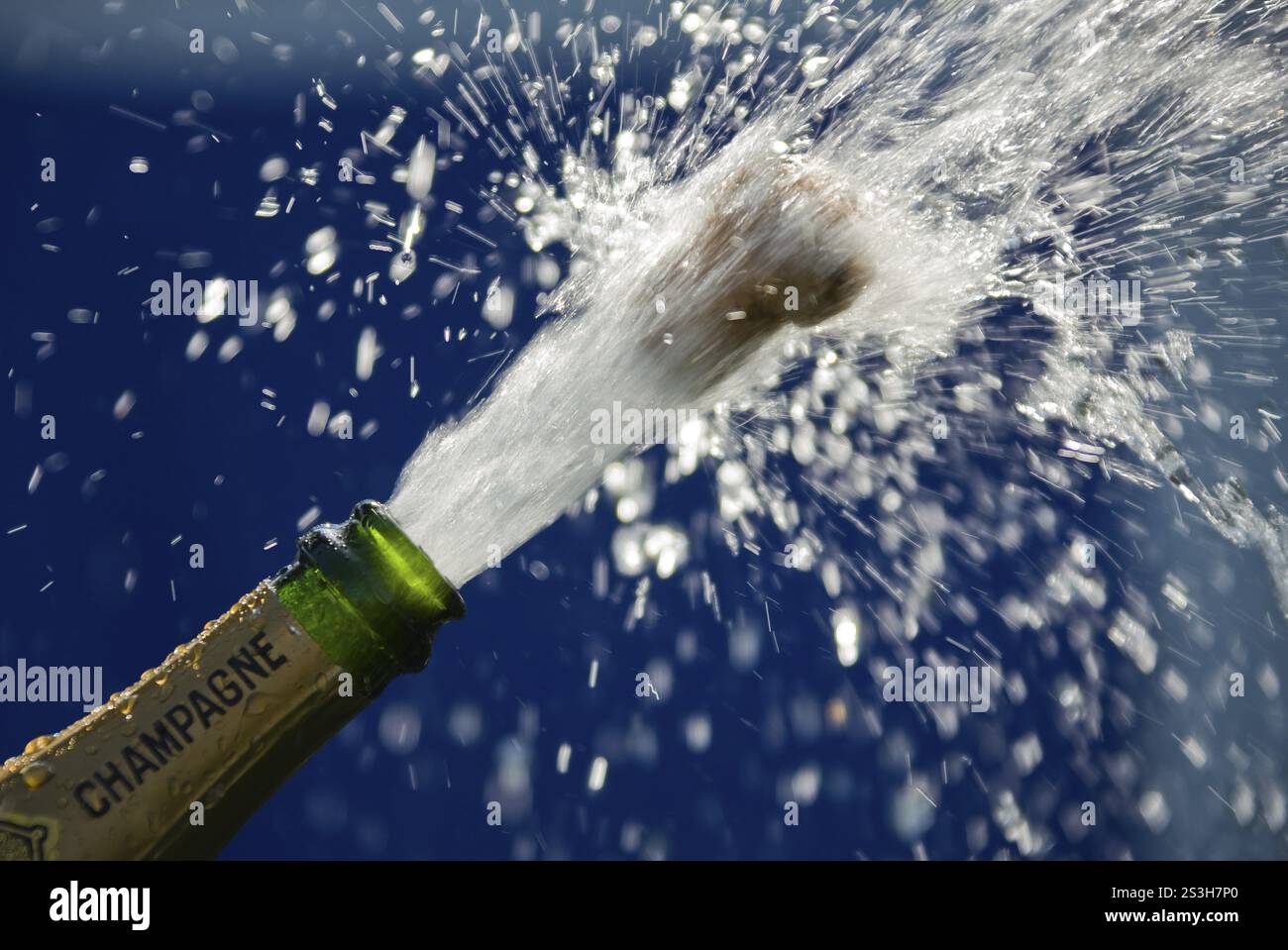Popping cork of an opened champagne bottle Stock Photo - Alamy