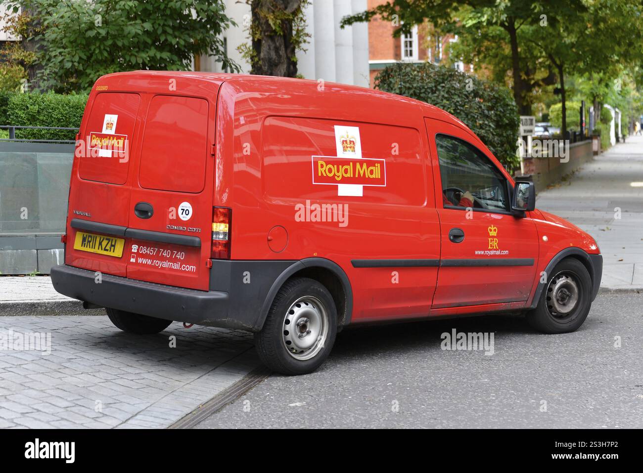 Red Royal Mail delivery van parked on the roadside in a town, London ...