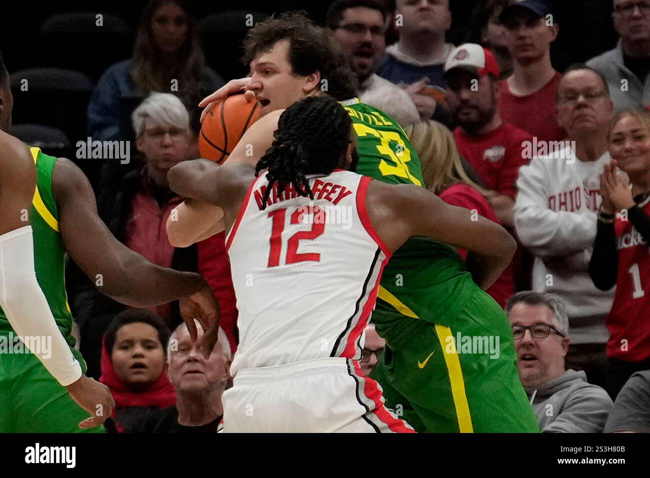 Ohio State guard Evan Mahaffey (12) fouls Oregon center Nate Bittle (32 ...