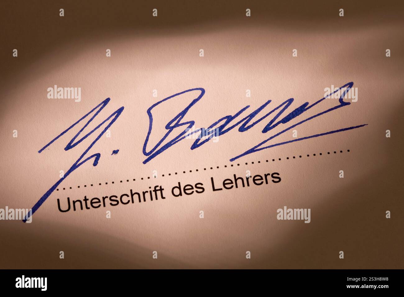 Handwritten signature under an official document of the school Stock ...