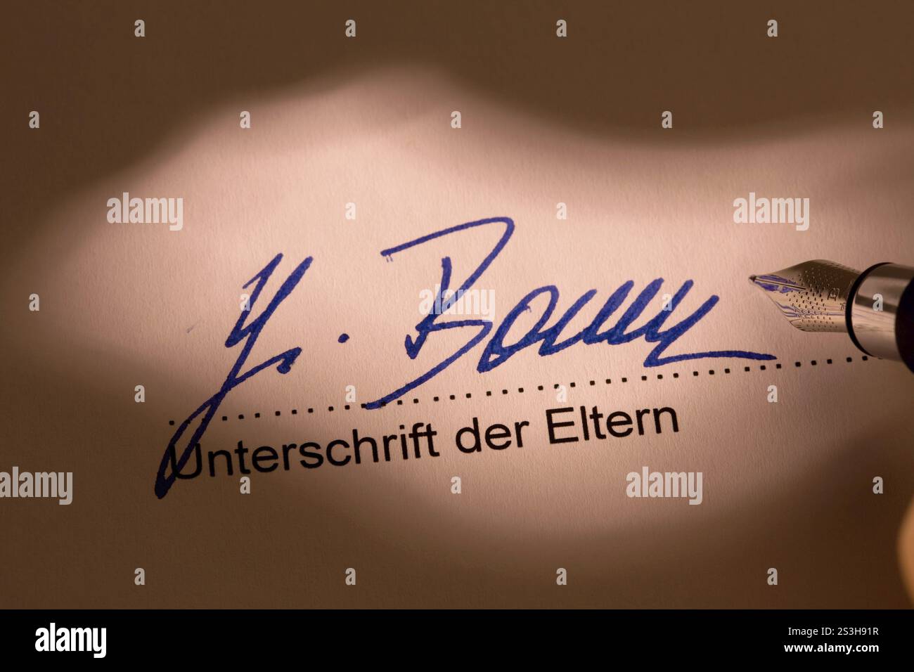 Parents' signature on a student's report card Stock Photo - Alamy