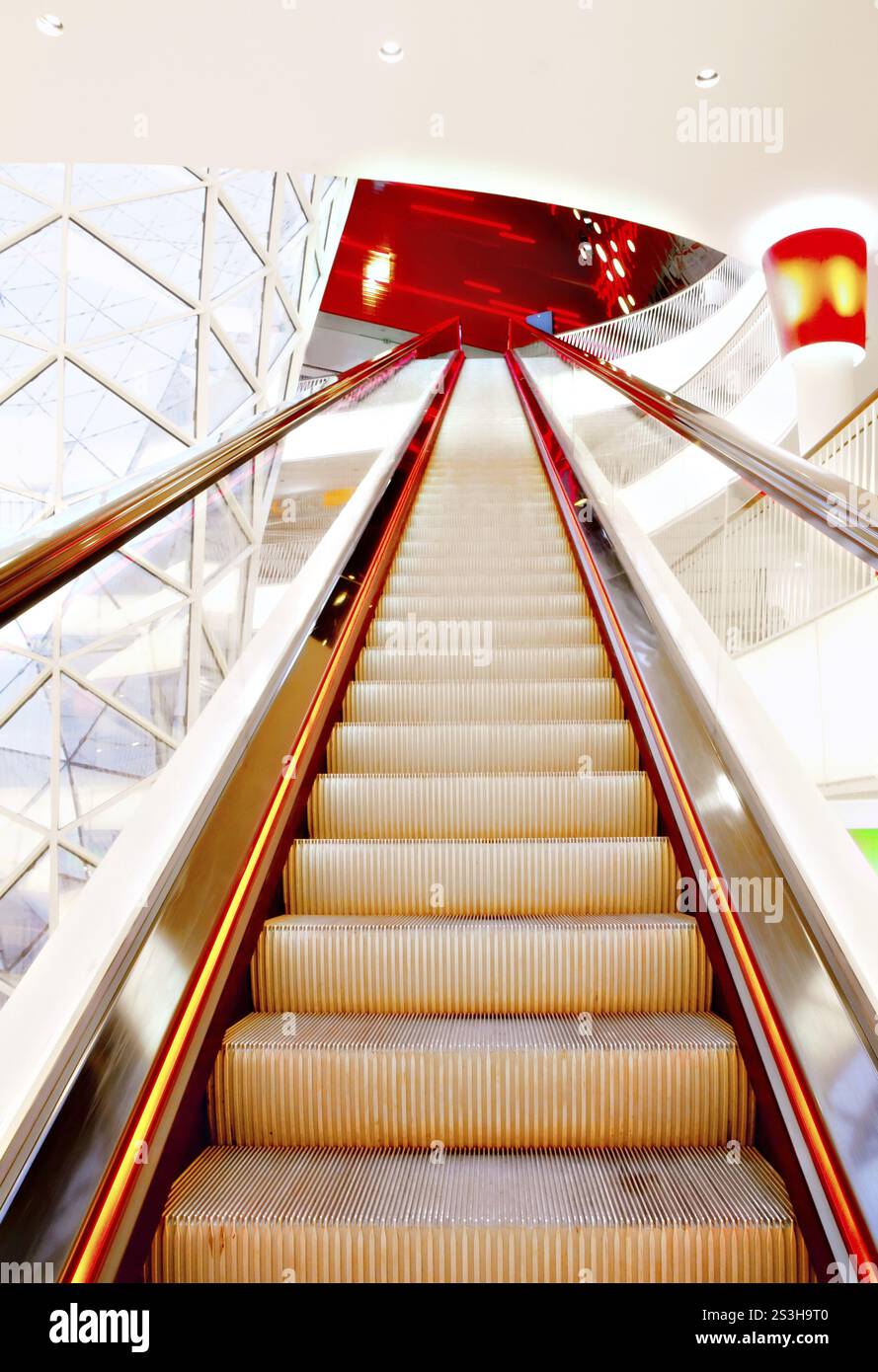 Moving escalator in a modern building Stock Photo - Alamy