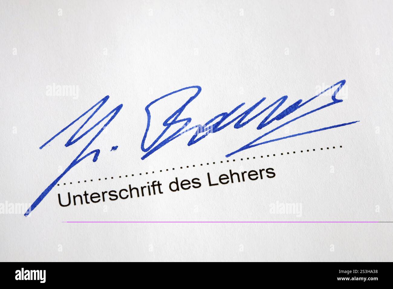 Handwritten signature under an official document of the school Stock ...