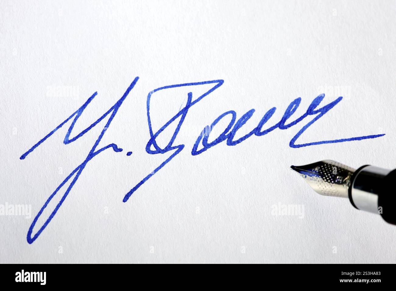 Handwritten signature with fountain pen under a letter Stock Photo - Alamy
