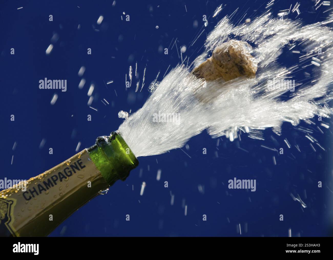 Popping cork of an opened champagne bottle Stock Photo - Alamy