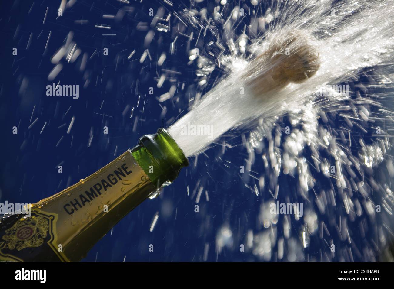 Popping cork of an opened champagne bottle Stock Photo - Alamy
