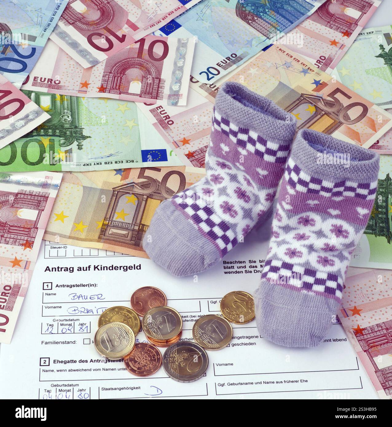 Children's socks and euro banknotes Stock Photo - Alamy