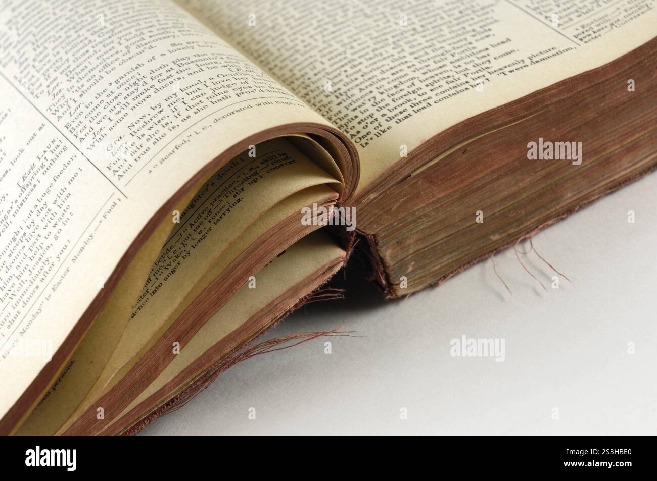 Old open tattered book pages closeup Isolated on white background Stock ...